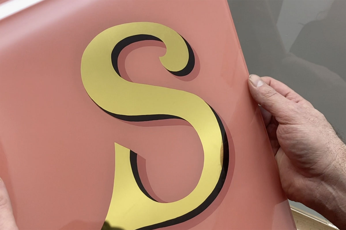 Adding a touch of elegance: how to use gold leaf for glass signs